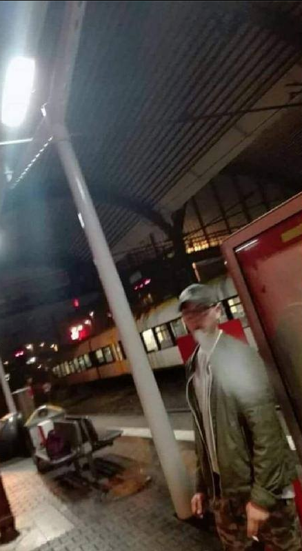 A stranger taking a candid photo of Marcel Hesse : masskillers